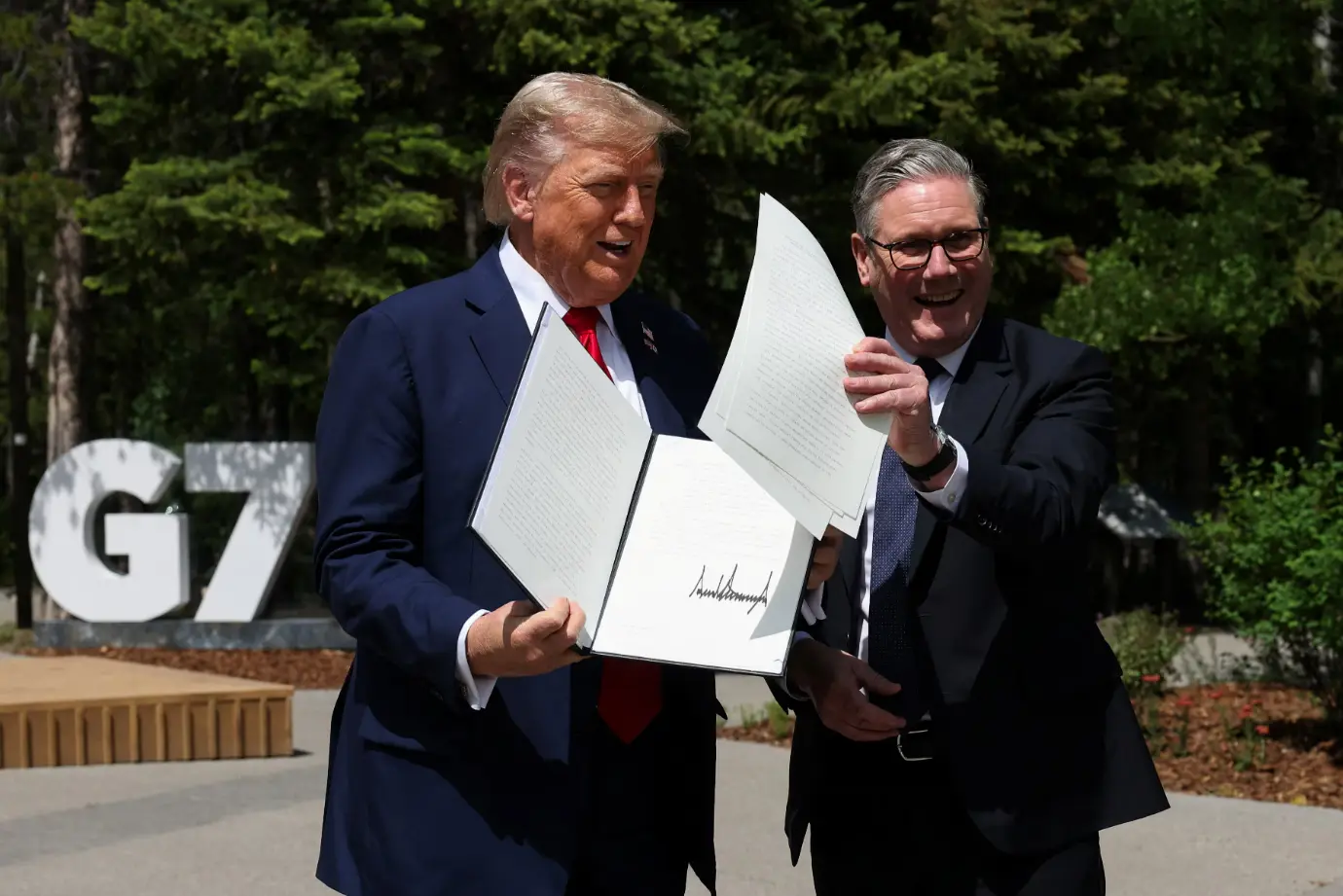 Trump signs US–UK trade deal at G7, says Britain ‘protected because I ...