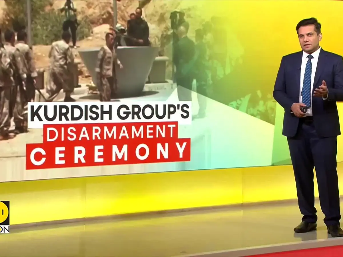 Kurdish fighters hand over weapons in symbolic gesture