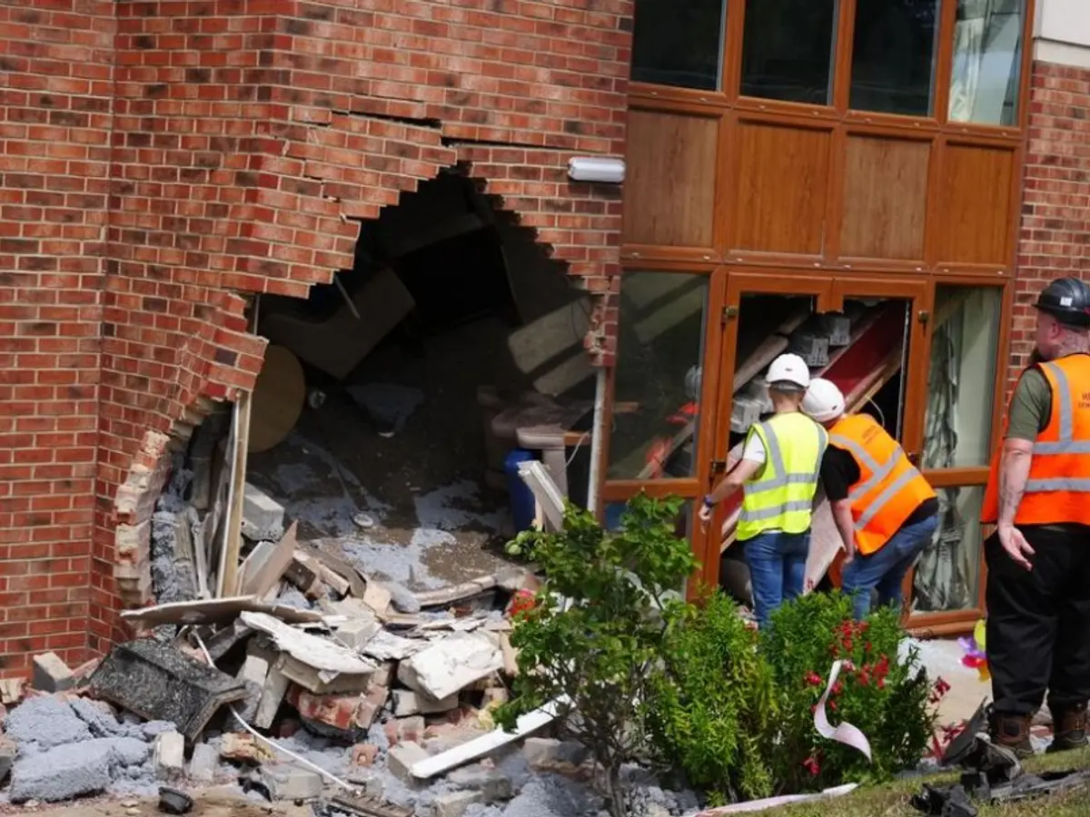 'Whole top floor caved in': BMW crashes into care home during police ...