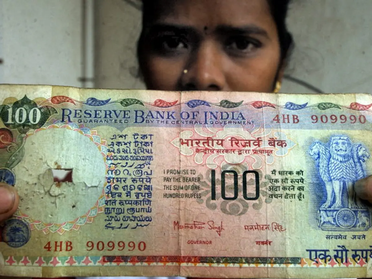 Why did the Indian rupee drop to an all-time low against the US dollar?