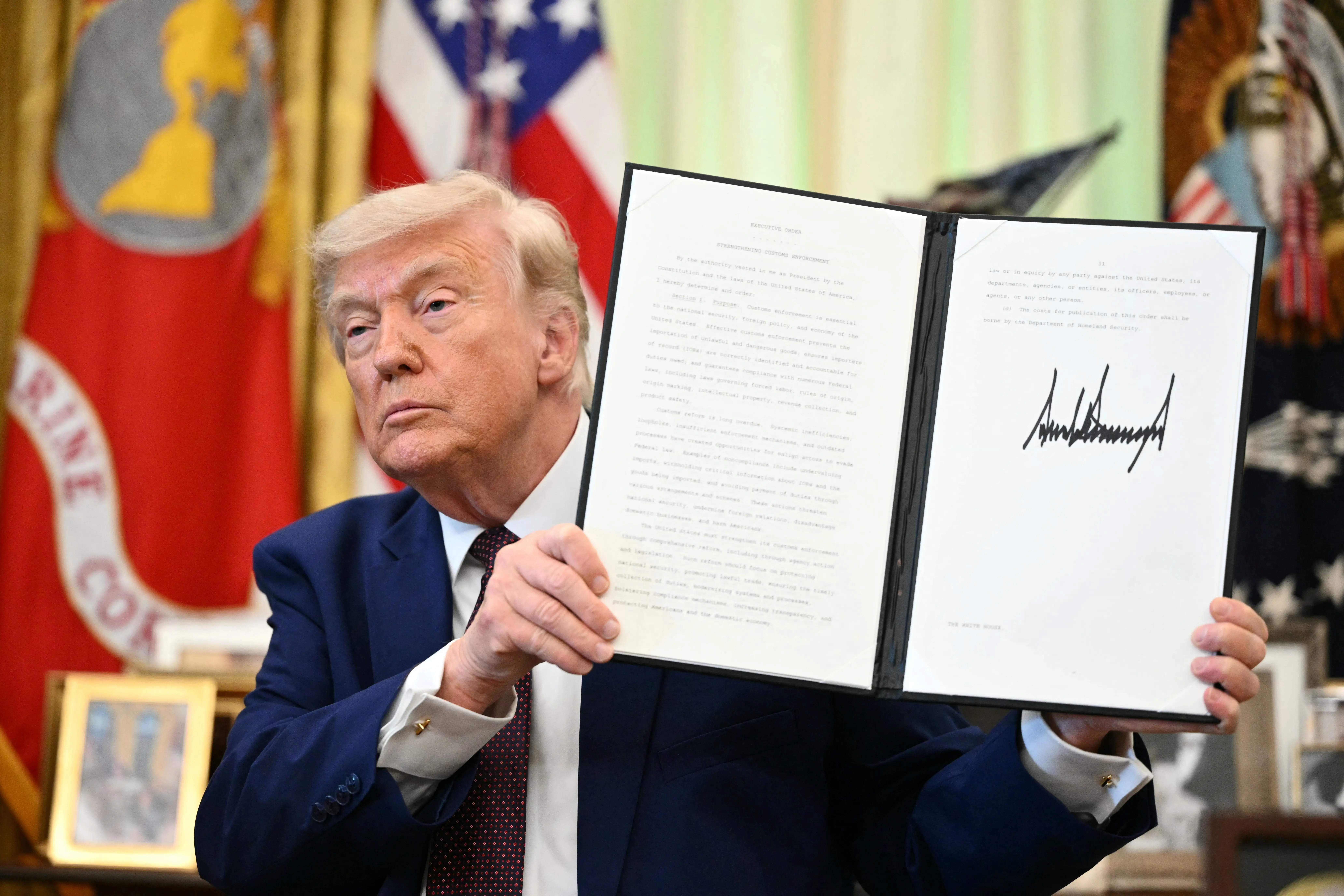 Trump signs order making easier to fire 8,000 senior federal employees